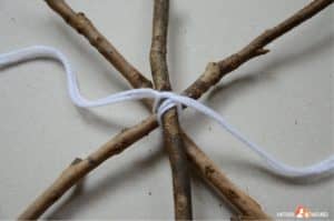 Stick spider web: spooktacular weaving fun! - Mother Natured